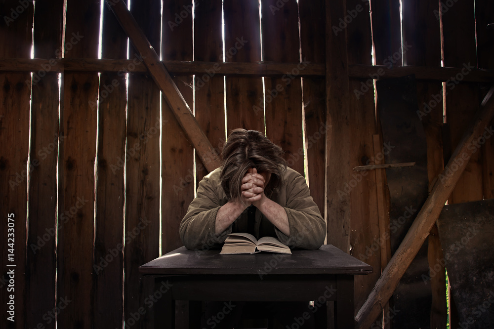 Man Praying Over Bible Stock Photo | Adobe Stock