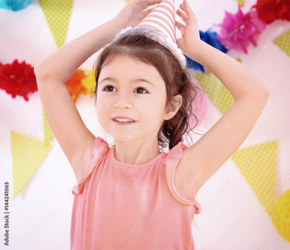 Cute little girl celebrating birthday at party Stock Photo | Adobe Stock