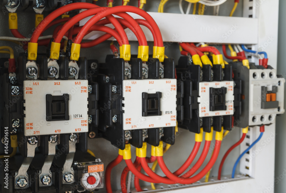 Close-up electrical wiring with fuses and contactors in control panel ...