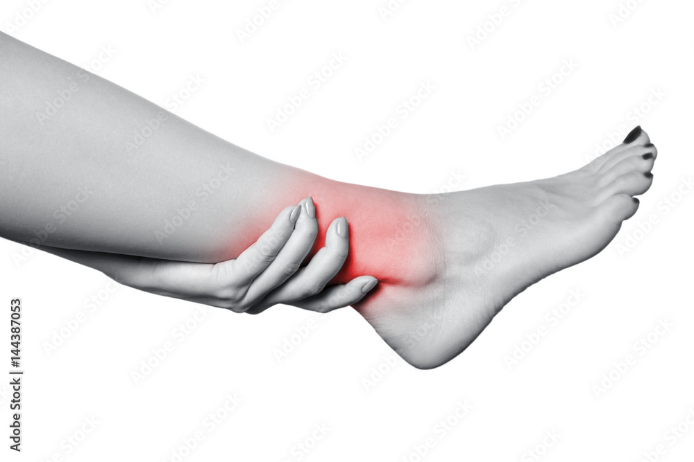 Closeup view of a young woman with pain on leg. isolated on white ...