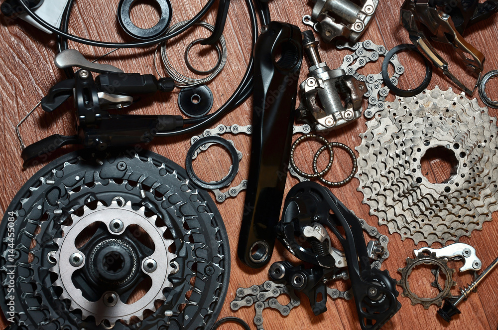 Many different metal parts and components of the running gear of a ...