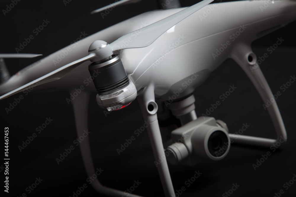 Close up of propeller of white drone (Quadrocopter) with camera on ...