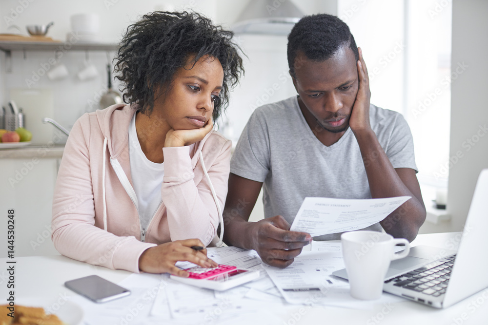 Stressed african american couple looking frustrated, having no money to ...