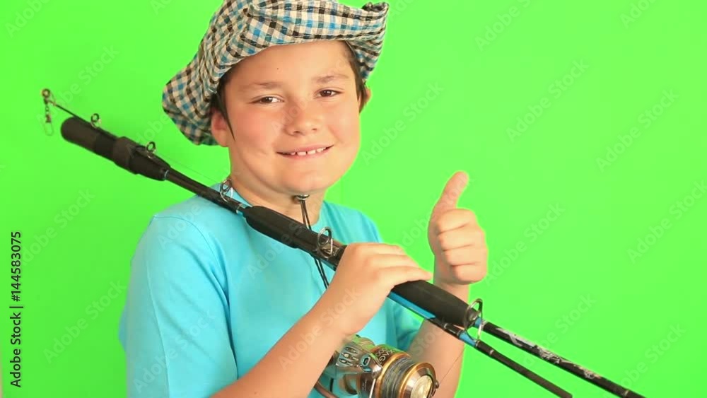 Boy posing with his fishing rod on chroma key green screen background ...