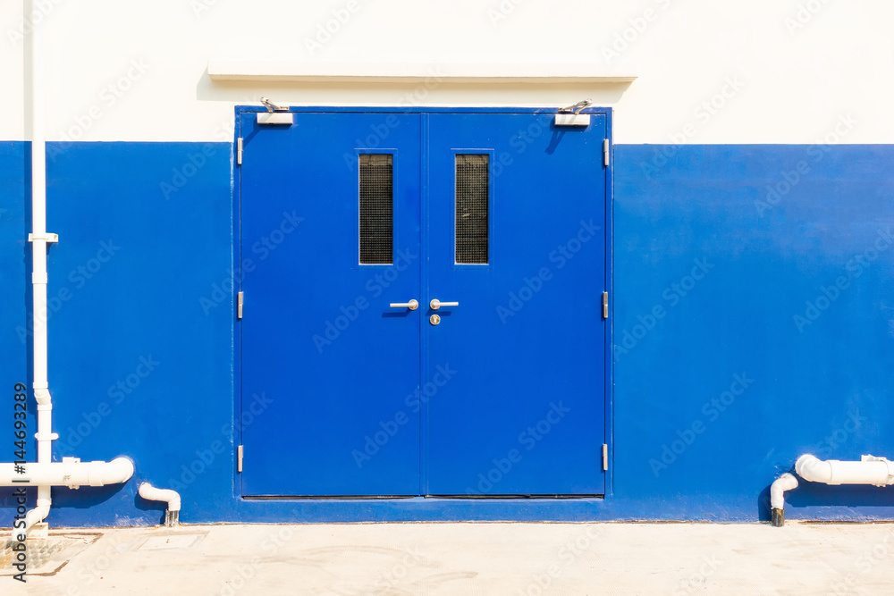 Fire exit door of warehouse building. Stock Photo | Adobe Stock