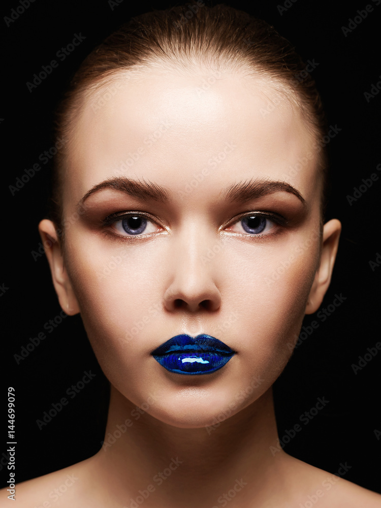 Beautiful woman face with blue lips gloss Stock Photo | Adobe Stock