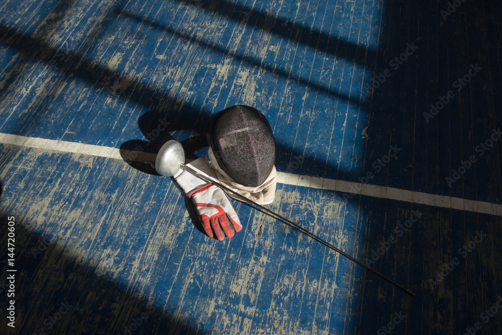 the fencer prepares for competitions. fencing coach. fencing sport ...