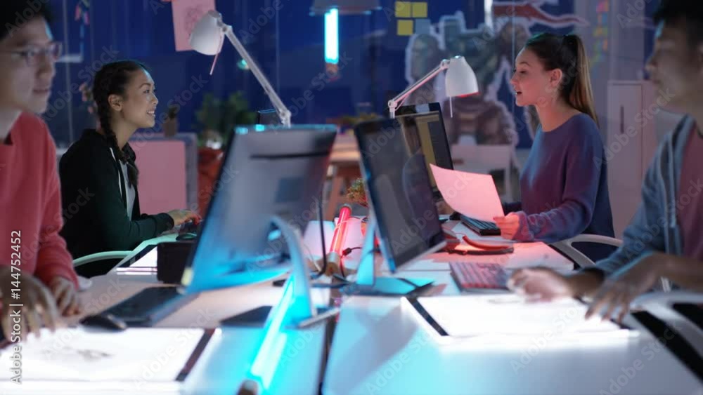 Young Asian video game developers working together on a project Stock ...