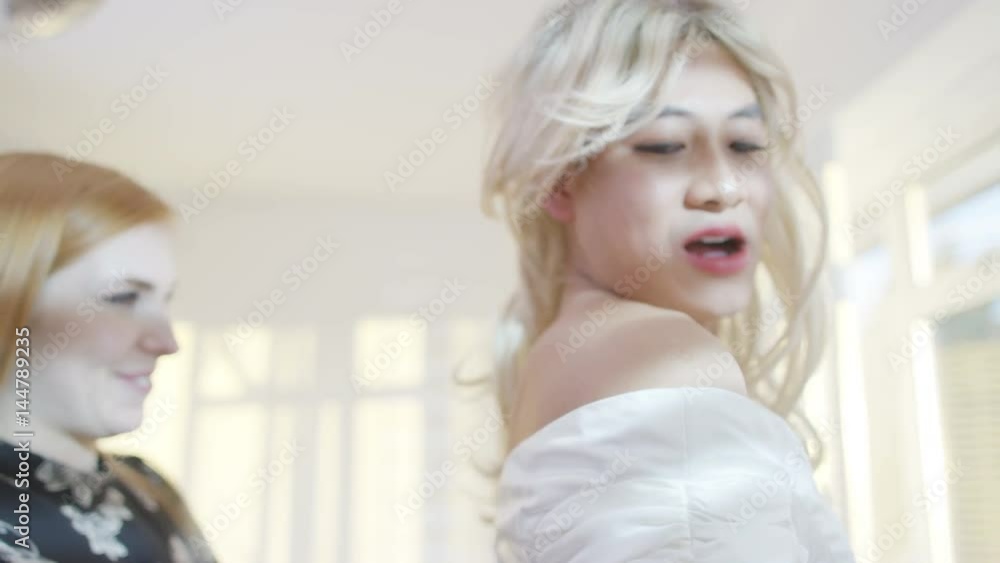 Transgender man dressed as bride getting ready for wedding day with ...
