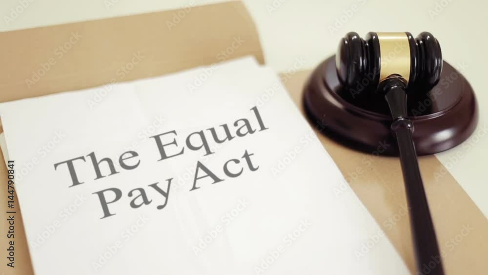 The Equal Pay Act written on folder with gavel placed on desk of judge ...