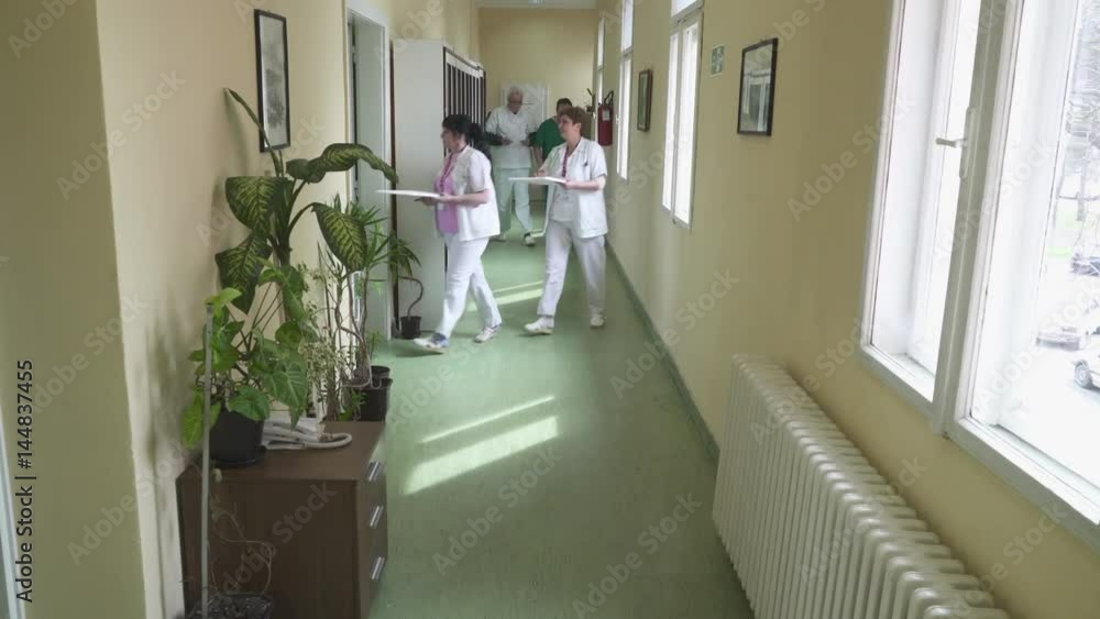 Active working scene crowd of medical personnel in hospital building ...