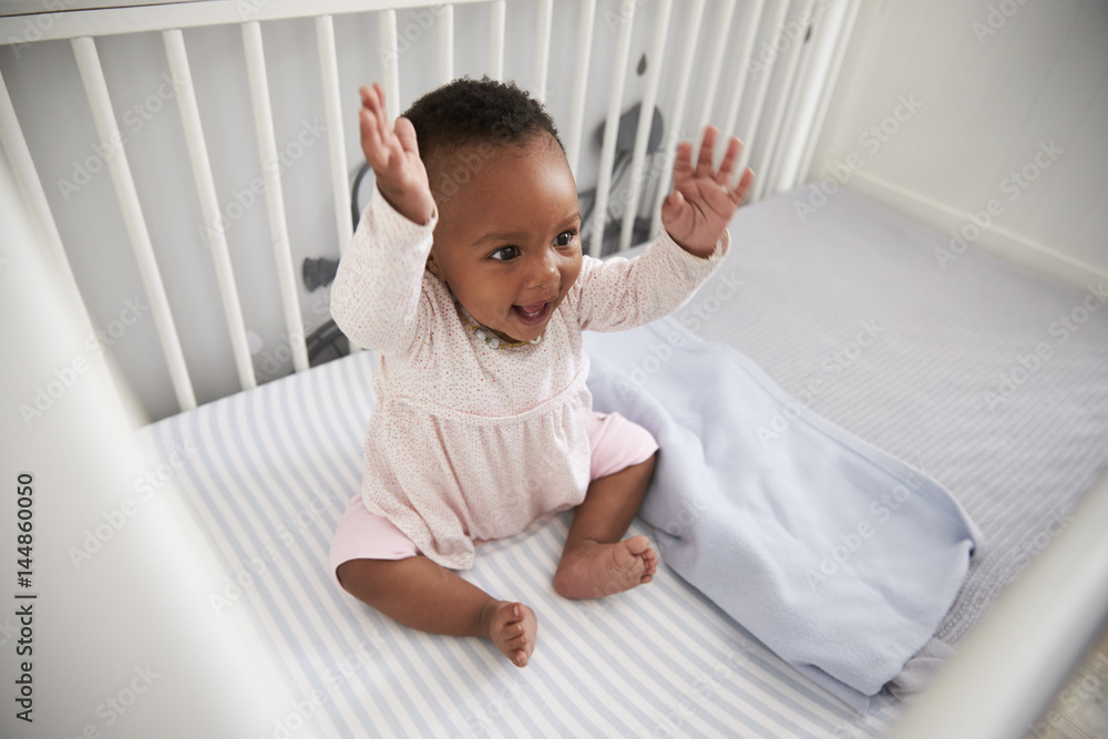 Happy Baby Girl Playing In Nursery Cot Stock Photo | Adobe Stock