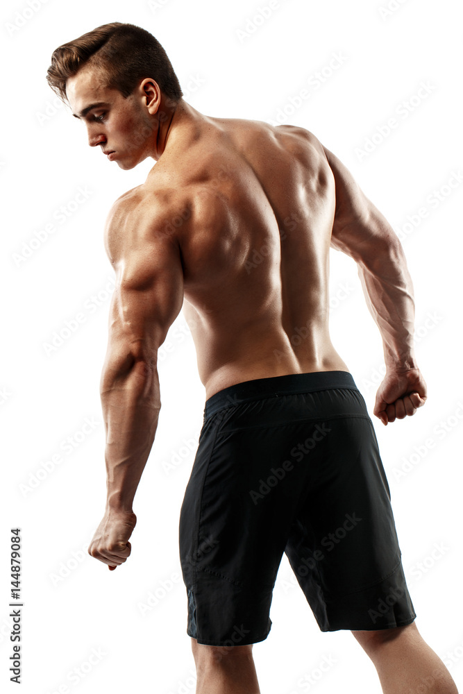 The back view of torso of attractive male body builder on white ...