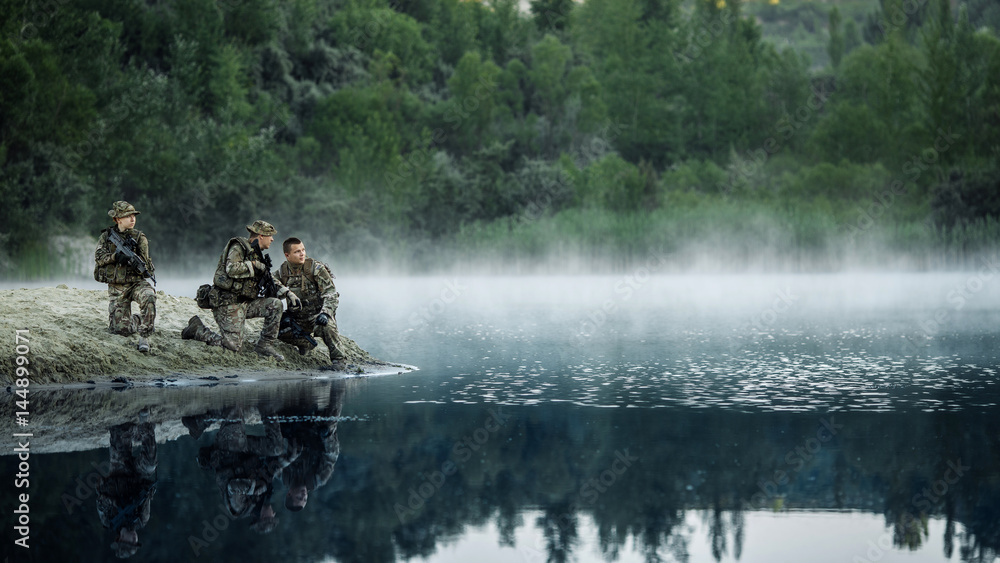 Special forces soldiers with weapon take part in military maneuver. war ...