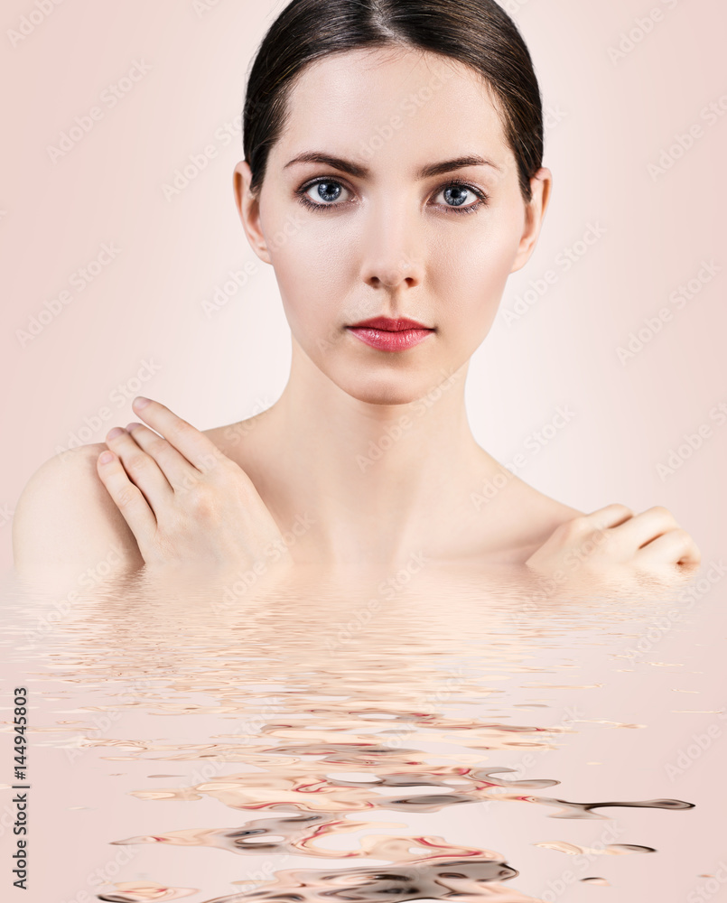 Beautiful woman with reflection on water surface Stock-Foto | Adobe Stock