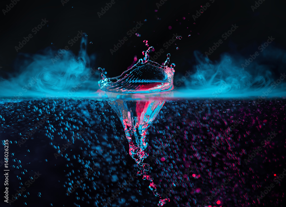 crown water splash with blue smoke over water Stock Photo | Adobe Stock