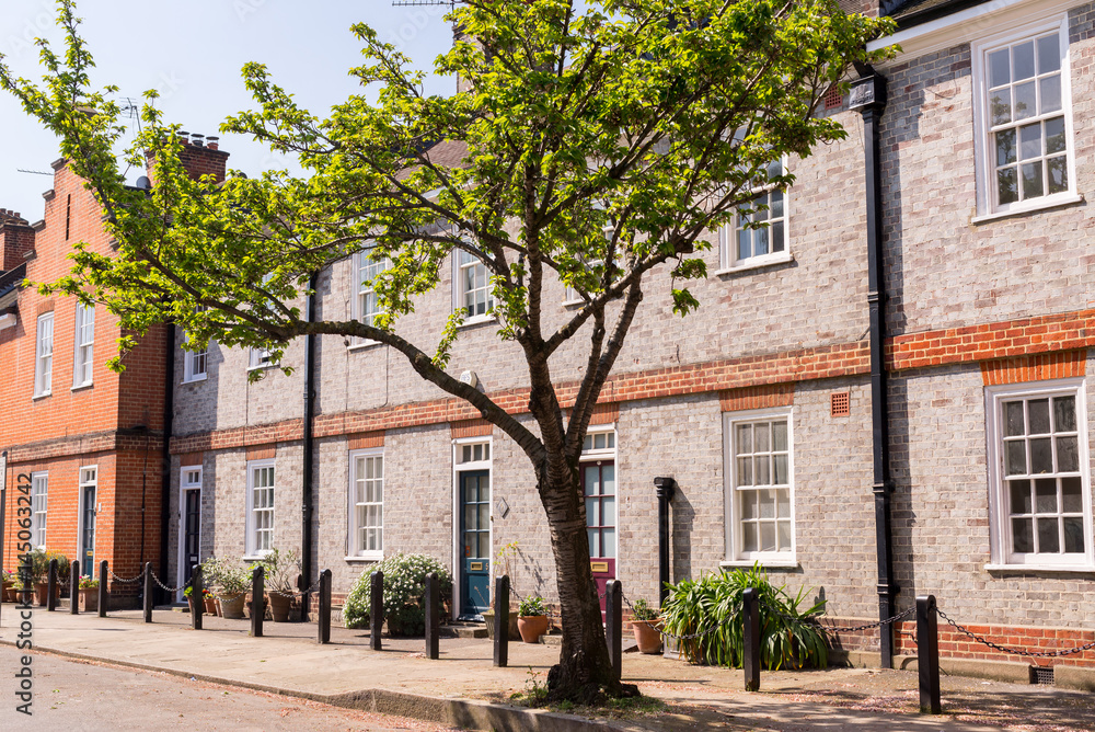 Classic British restored Victorian brick houses on a local road with ...