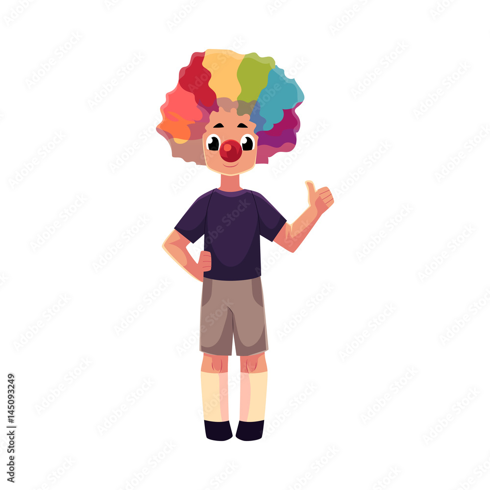 Little boy wearing clown nose and rainbow colored wig showing thumb up ...