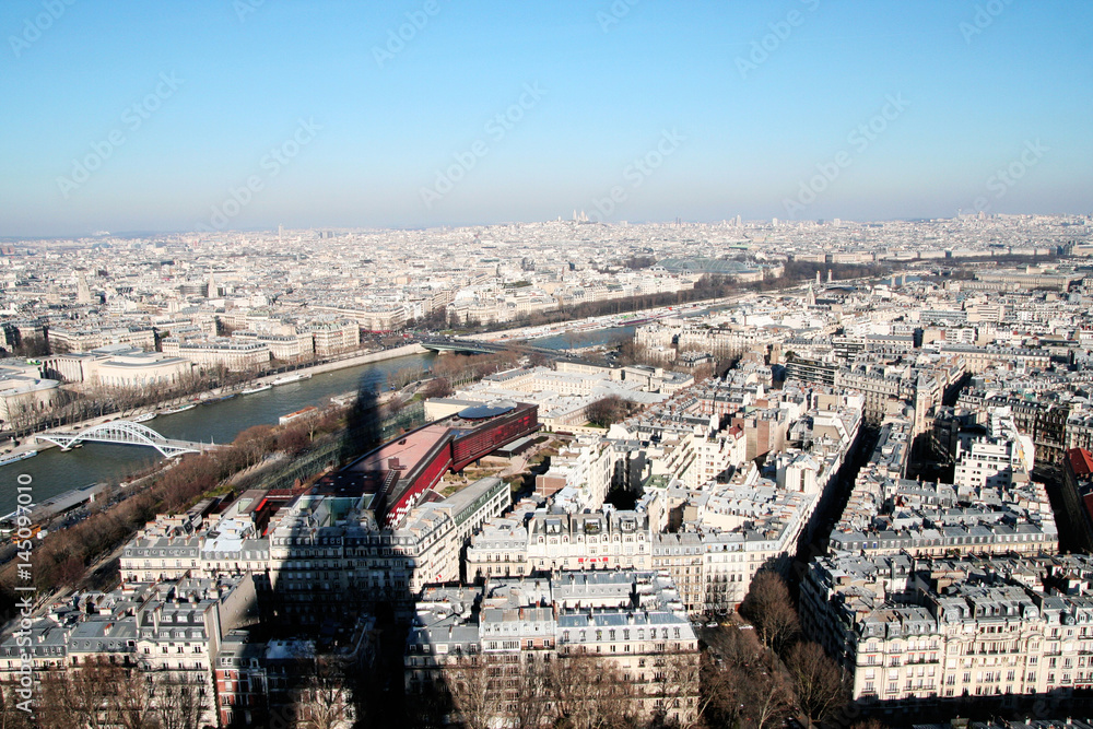 Paris View over Paris from Eiffel Tower with shadow of tower toward ...