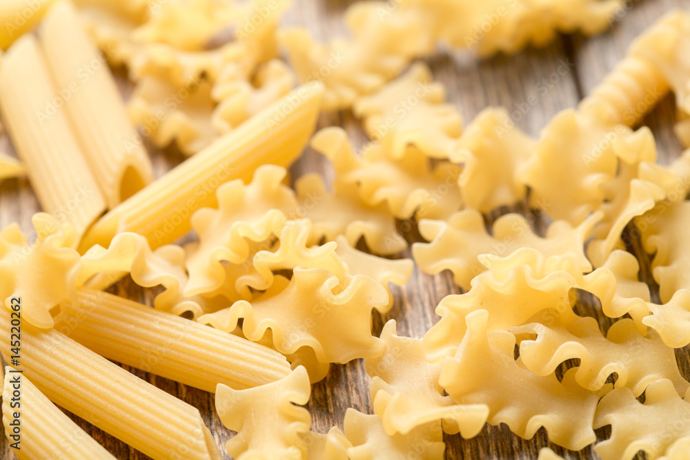 Variety of types and shapes of dry Italian pasta. Italian Macaroni raw ...