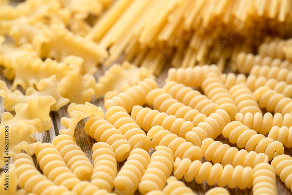 Variety of types and shapes of dry Italian pasta. Italian Macaroni raw ...
