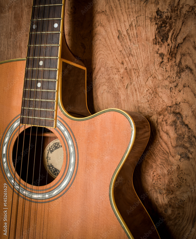 Vintage acoustic guitar on rustic wood background. Stock Photo | Adobe ...