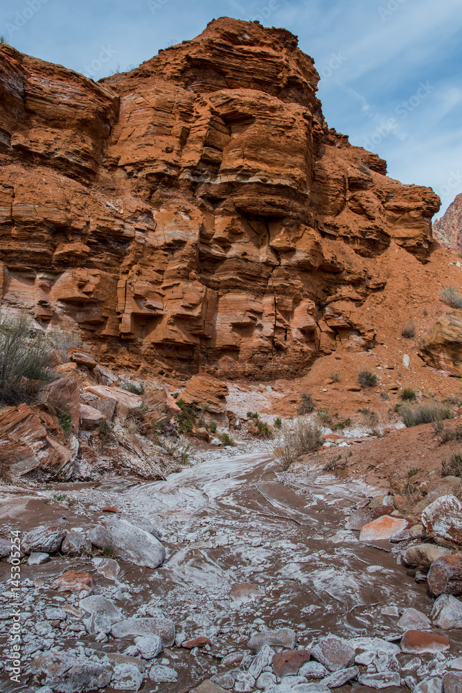 Red Rocks Sit Above White Mineral Covered Wash Stock Photo | Adobe Stock