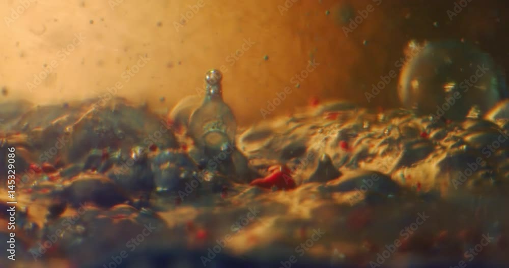Stars wars of the planet.Color drops floating in oil and water over a ...
