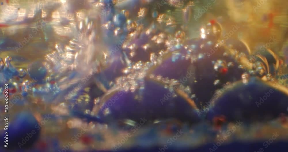 Stars wars of the planet.Color drops floating in oil and water over a ...