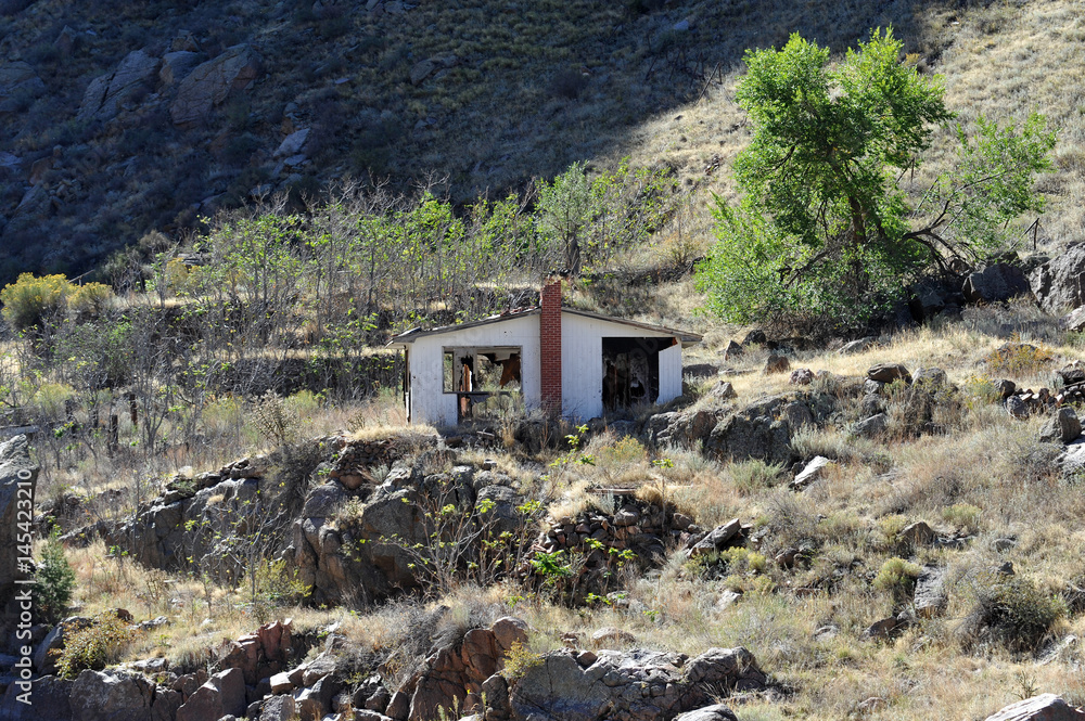 Abandoned and dilapidated shack at the base of a mountain in Royal ...