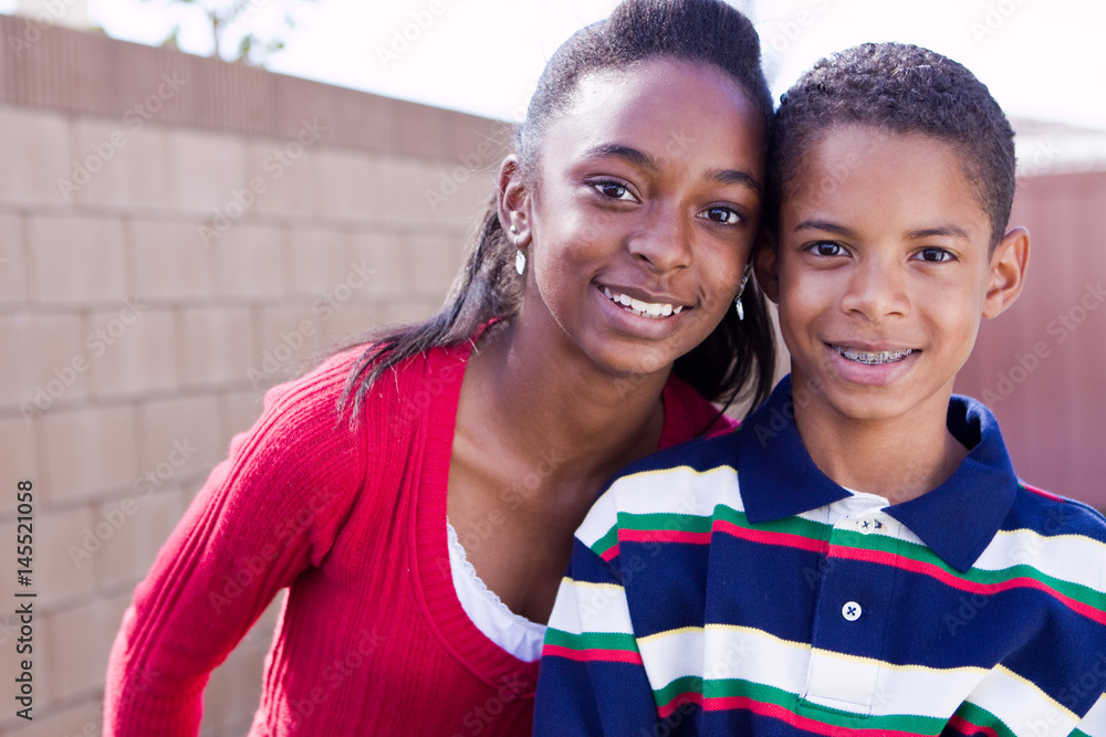 Happy African American brother and sister smiling. Stock Photo | Adobe ...