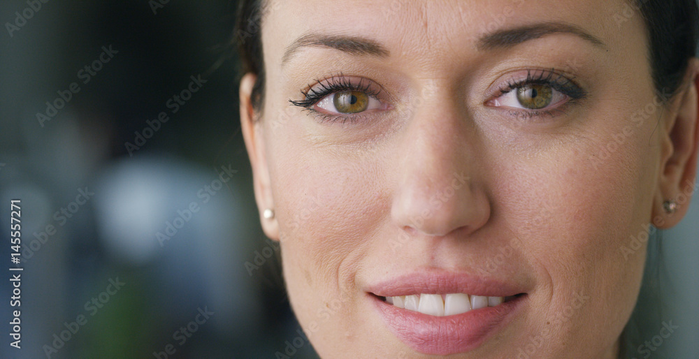 Portrait of a beautiful girl smiling at the camera, eyes closed, shot ...