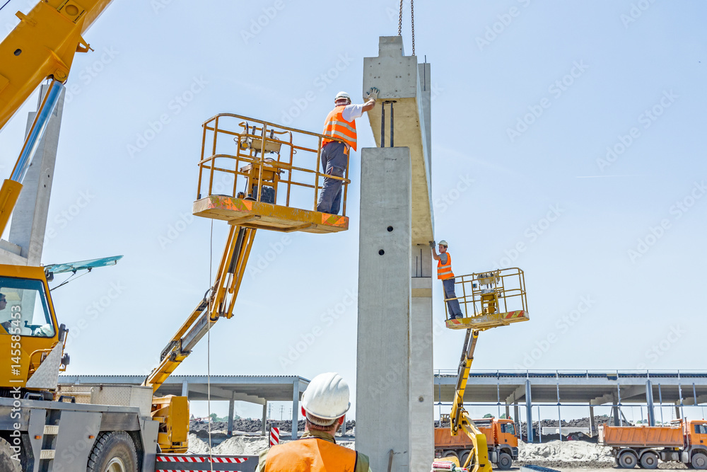 High elevated cherry picker with people who are working in heavy duty ...
