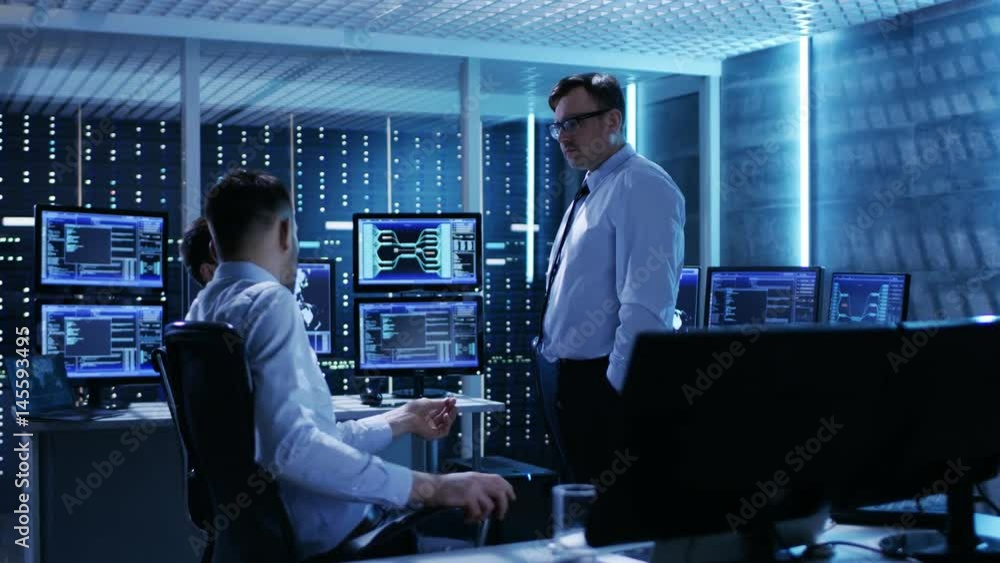 Team of Technical Moderators Have Discussion in Monitoring Room. System ...