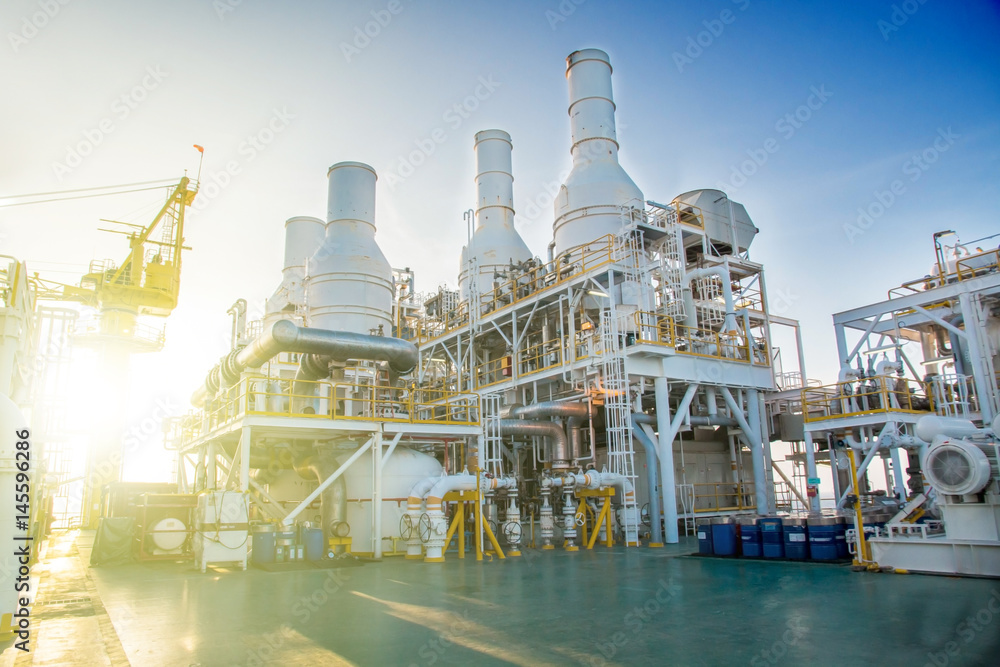 Sunset or sun rise time,Exhaust of gas turbine engine at offshore oil ...