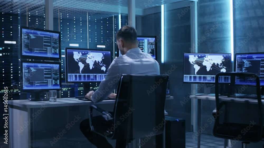 Technical Controller Working at His Workstation with Multiple Displays ...