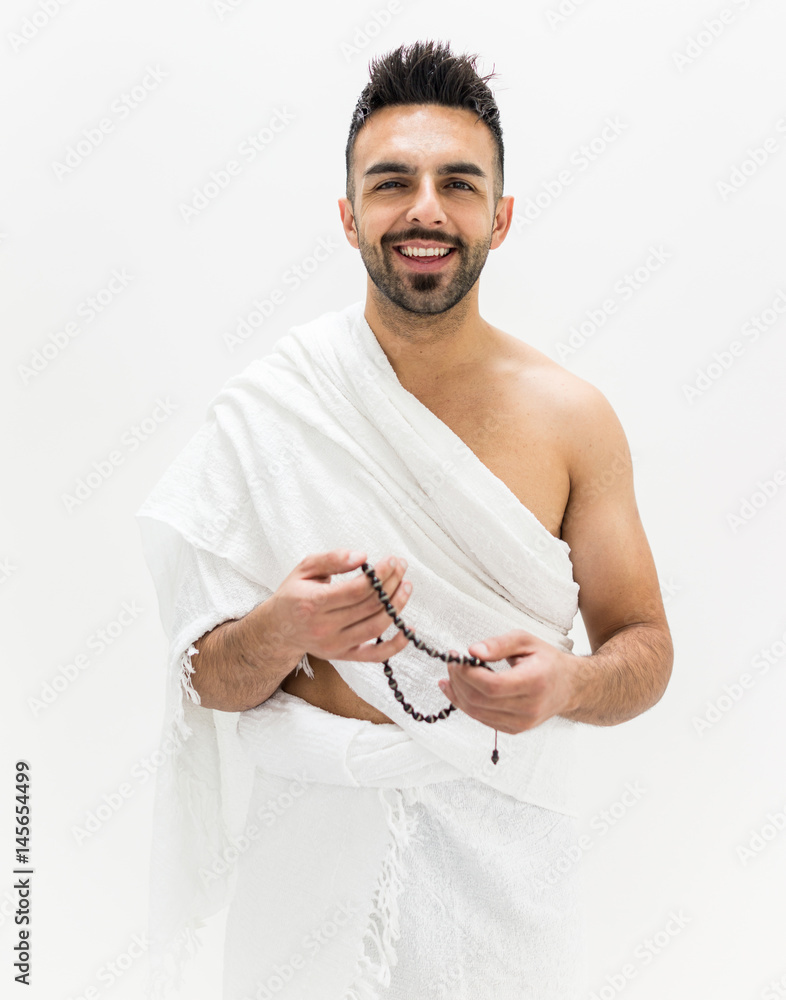 Muslim man posing as ready for Hajj visiting Kaaba in Mecca Stock Photo ...