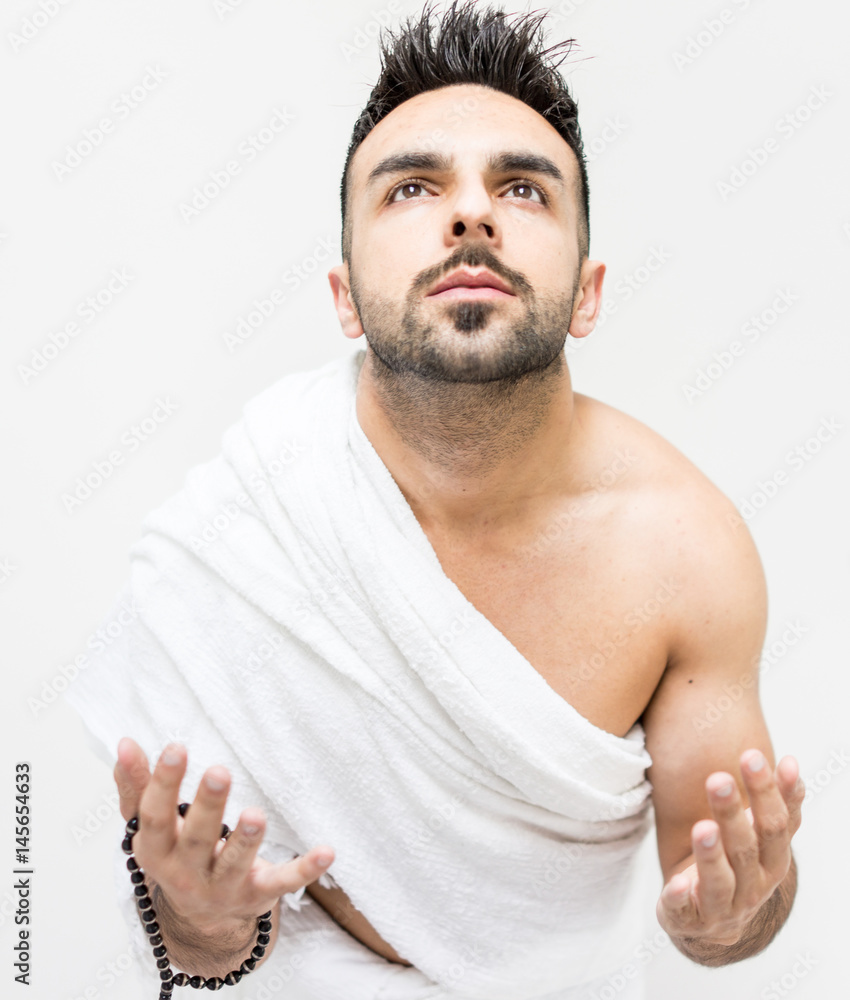 Muslim man posing as ready for Hajj visiting Kaaba in Mecca Stock Photo ...