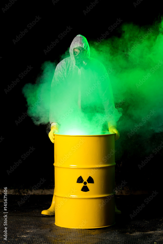 biohazard worker and radioactive green smoke coming out from yellow ...