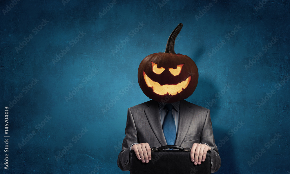 Scary businessman with pumpkin head Stock Photo | Adobe Stock