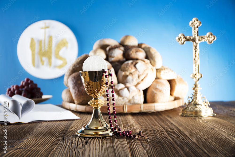 First Holy communion. Catholic theme. Crucifix, chalice, bible, bread ...