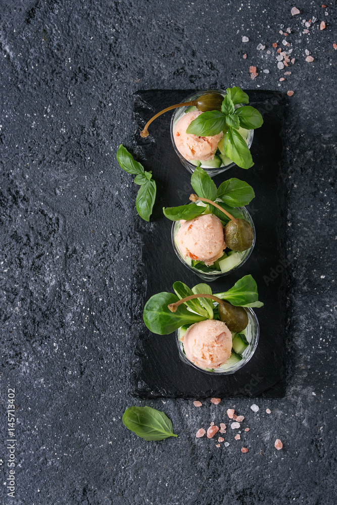 Verrines appetizer with salmon pate, red caviar, cucumber, cream cheese ...