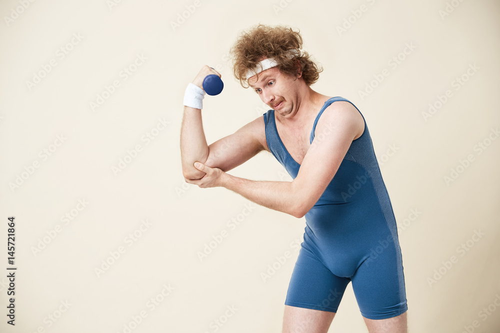 Weak man can't make it. Working out with ligt dumbbell Stock Photo ...