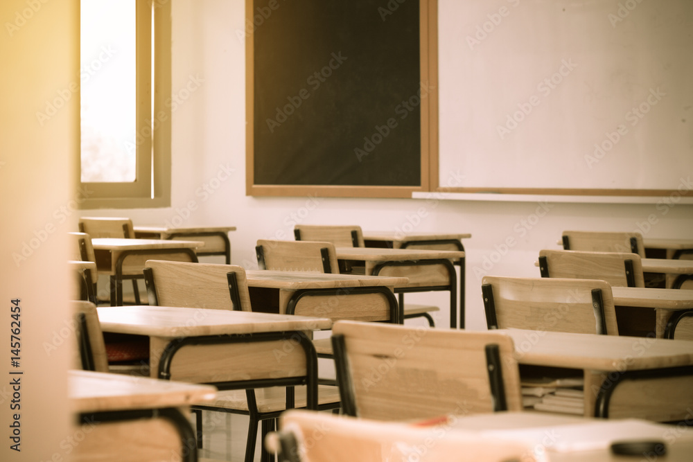 School classroom with desks chair wood, and blackboard in high school ...