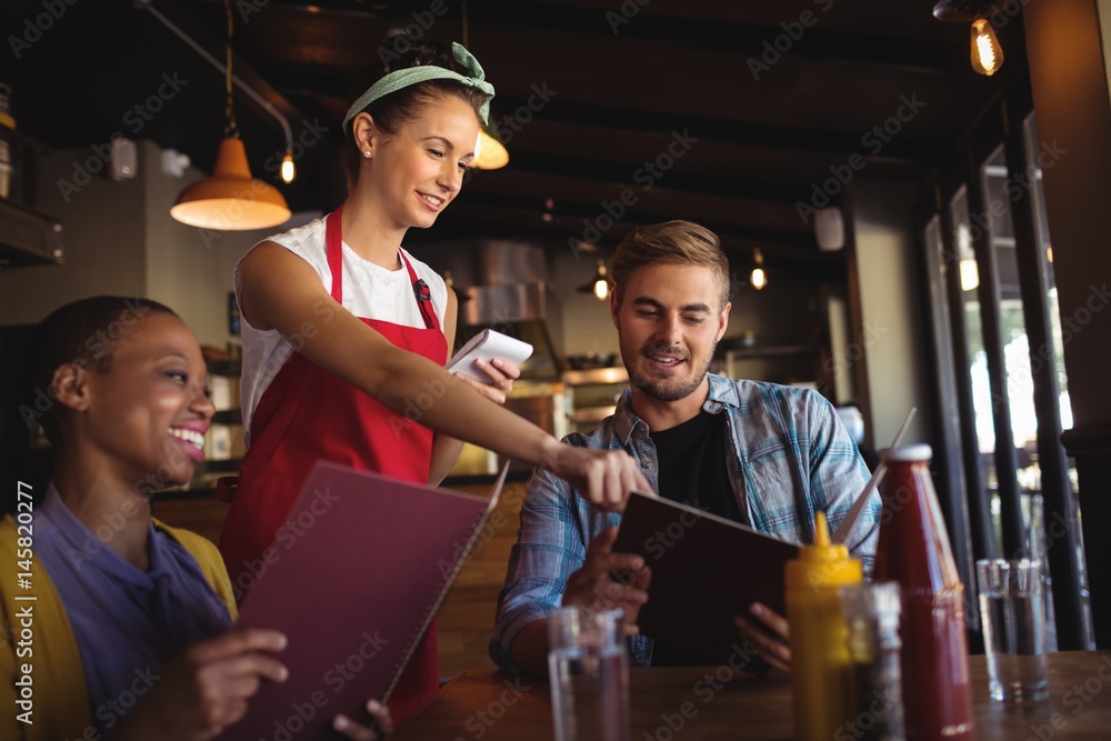 Waitress taking order at restaurant Stock Photo | Adobe Stock