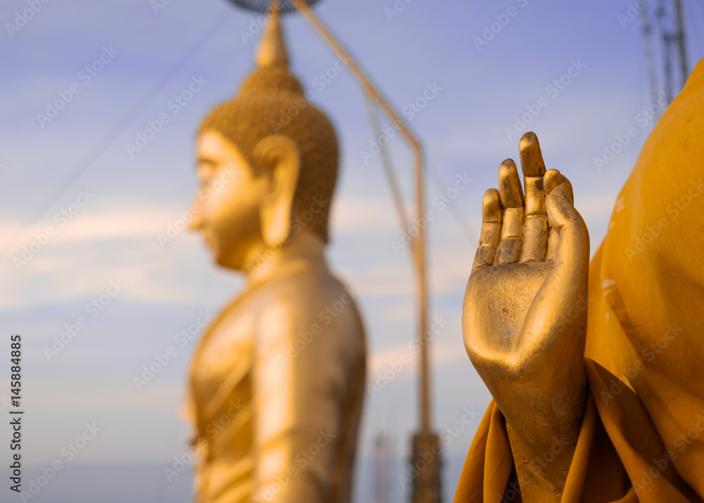Golden Buddha and hand of praying buddhist monk's statue, TIger Cave ...
