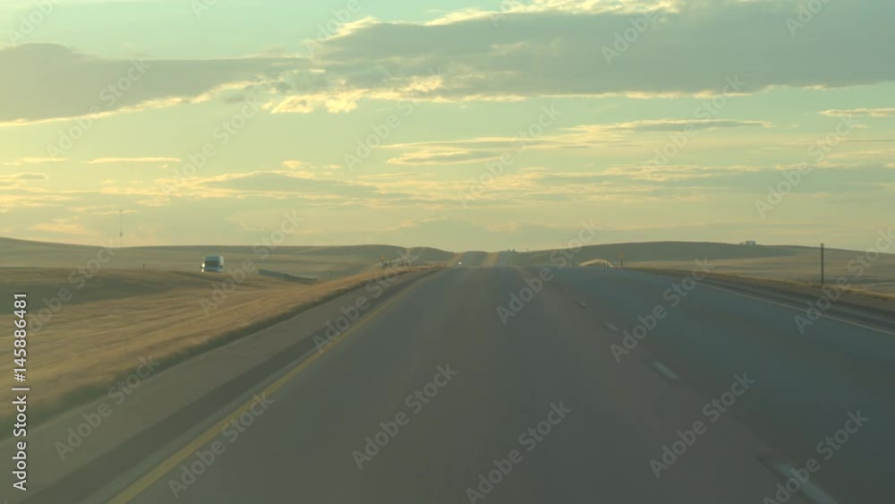 POV Road trip on sunny autumn morning, driving through scenic vast ...