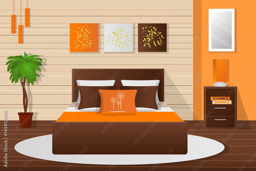The interior of the bedroom. Cozy room in orange colour with the ...
