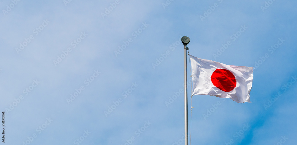 japan flag with blue sky background. Stock Photo | Adobe Stock