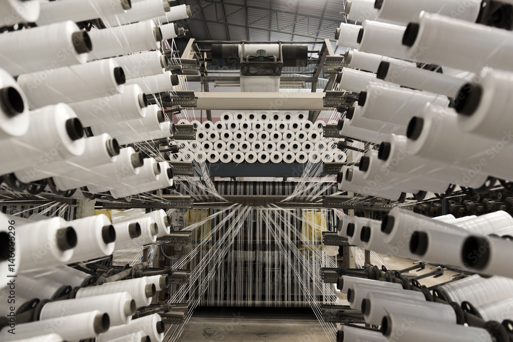 Process of rolling plastic fiber for plastic sack Stock Photo | Adobe Stock